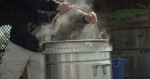 Man Lowering Crawfish Into Boiler, RED C... | Stock Video | Pond5