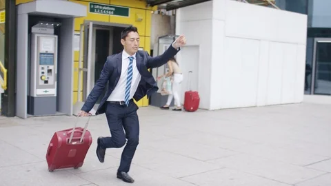 Man with luggage running late, in slow m... | Stock Video | Pond5