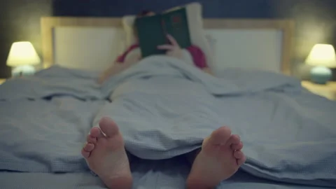 Man lying in bed before going to sleep r... | Stock Video | Pond5