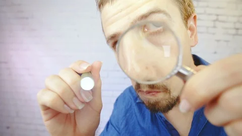 Man with magnifying glass and flashlight... | Stock Video | Pond5