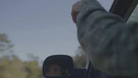 Man Making Waves with His Hand Outside t... | Stock Video | Pond5