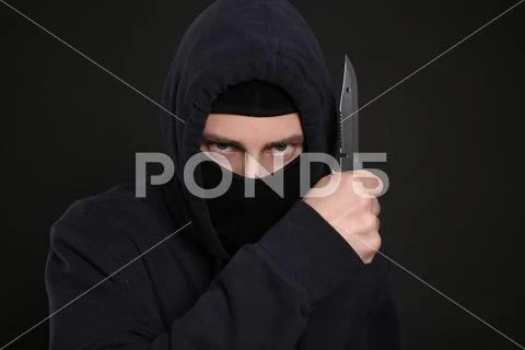 Man in mask with knife on black background. Dangerous criminal ~ Hi Res ...