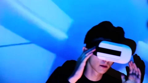 Man move, draws figures in the air. Youn... | Stock Video | Pond5