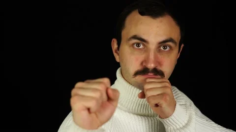 Man with mustache standing in fighter po... | Stock Video | Pond5