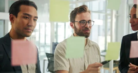 Man, notes and happy by glass with group... | Stock Video | Pond5