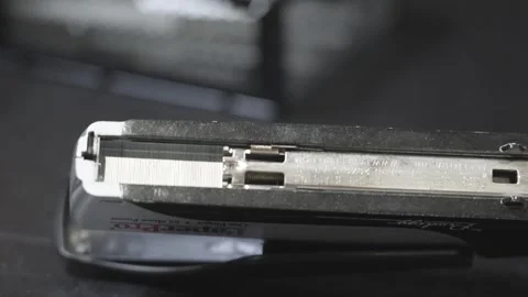 A man opening a stapler. Slow motion and... | Stock Video | Pond5