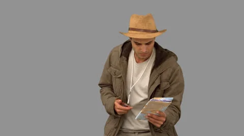 Man orienteering with a map and a compas... | Stock Video | Pond5