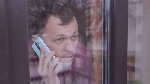 Man outside the window, looking at the s... | Stock Video | Pond5