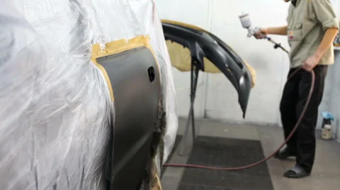 Man paints car bumper in paint booth at ... | Stock Video | Pond5