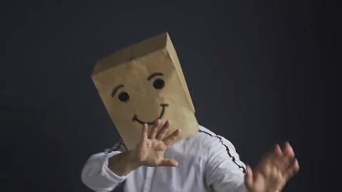 A man with a paper bag on his head, with... | Stock Video | Pond5