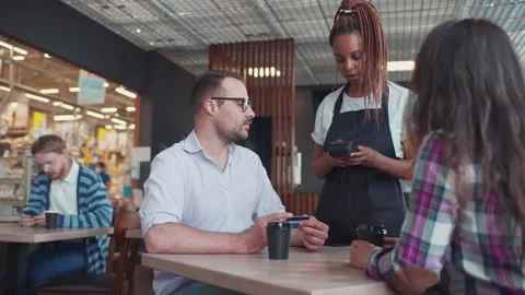 Man paying for lunch with girlfriend in ... | Stock Video | Pond5