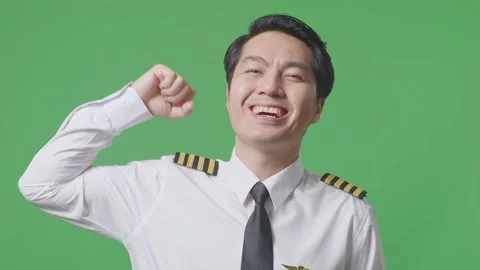 Man Pilot Smiling And Flexing His Bicep ... | Stock Video | Pond5