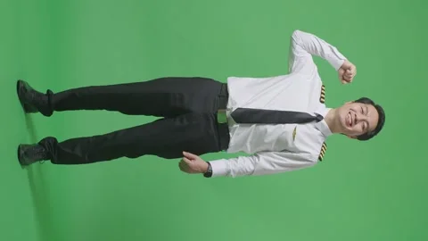 Man Pilot Smiling And Flexing His Bicep ... | Stock Video | Pond5