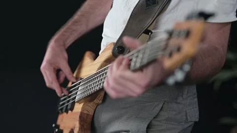Man Playing Bass black Studio background | Stock Video | Pond5