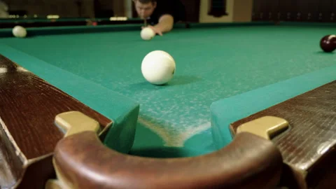 Man playing billiards, hitting balls wit... | Stock Video | Pond5