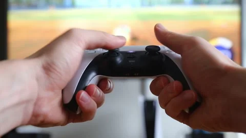 Man playing with Playstation 5. Focus on... | Stock Video | Pond5