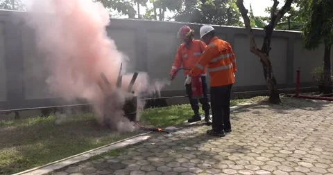 A man practises how to use a fire-exting... | Stock Video | Pond5