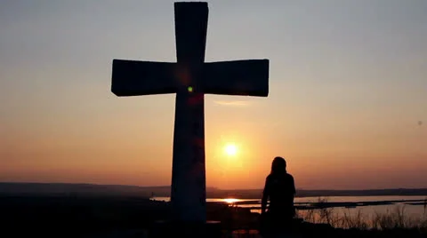 Man praying under the cross | Stock Video | Pond5