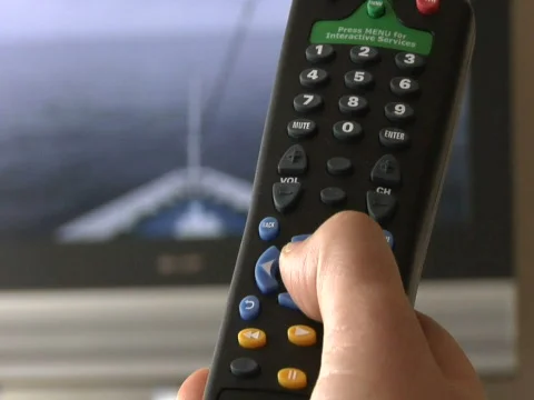 man presses SELECT on tv remote | Stock Video | Pond5