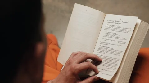 A man in prison reading bible. Prison in... | Stock Video | Pond5
