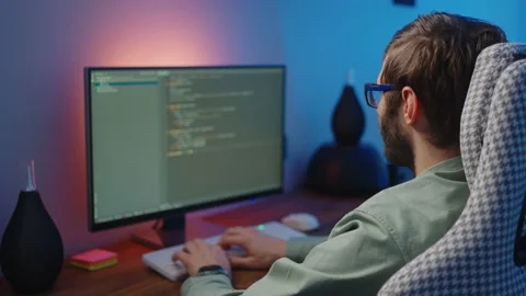 Man programmer typing on a keyboard code... | Stock Video | Pond5