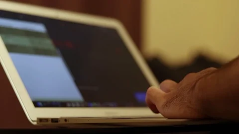 Man programming on laptop close up side ... | Stock Video | Pond5