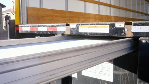 Man Pulling Out a Metal Ramp of a Moving... | Stock Video | Pond5