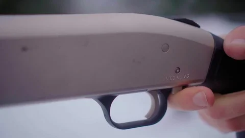 man pulling trigger and safety | Stock Video | Pond5