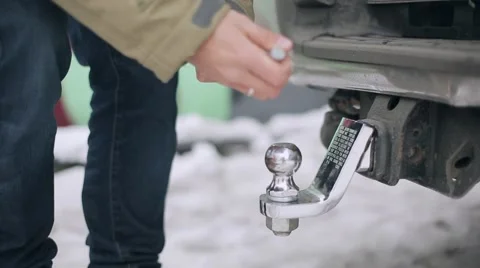 Man putting and fixing new metallic tow ... | Stock Video | Pond5