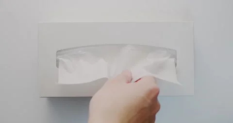 Man quickly pull out a piece of tissue f... | Stock Video | Pond5