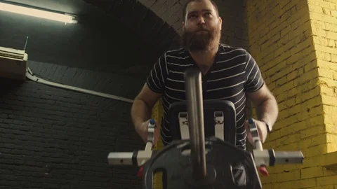 man raises heavy bars and dumbbells in t... | Stock Video | Pond5