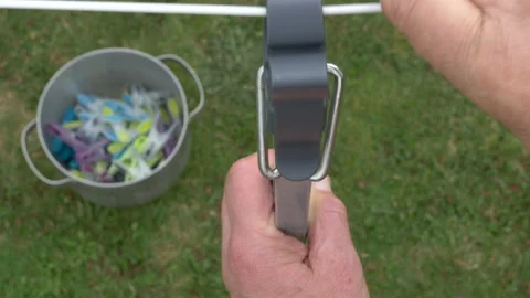 Man raising a telescopic washing line po... | Stock Video | Pond5