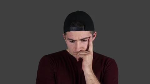 man reasoning while standing on gray bac... | Stock Video | Pond5