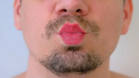 Man with red lipstick on lips giving a k... | Stock Video | Pond5