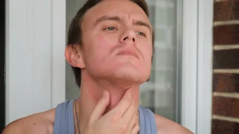 A man with redness on the skin of the ne... | Stock Video | Pond5