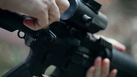 A man reloading an assault rifle, machin... | Stock Video | Pond5