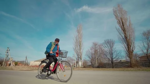 Man riding bicycle with a sad face weari... | Stock Video | Pond5
