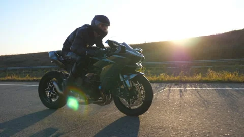 Man riding on modern sport motorbike at ... | Stock Video | Pond5