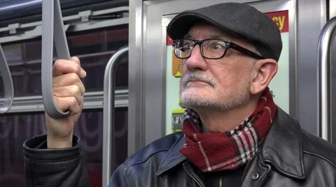 man riding train, holding safety strap | Stock Video | Pond5