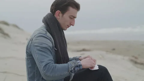 Man Rolling up Letter While Sitting on B... | Stock Video | Pond5