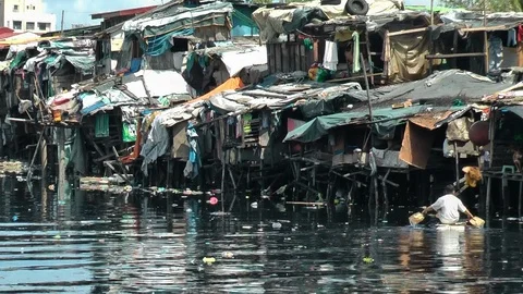 Man Rowing On River In The Slum Of Tondo... | Stock Video | Pond5