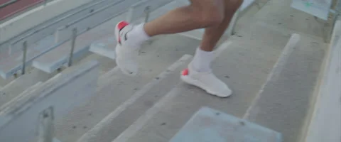 Man Running up Bleachers | Stock Video | Pond5