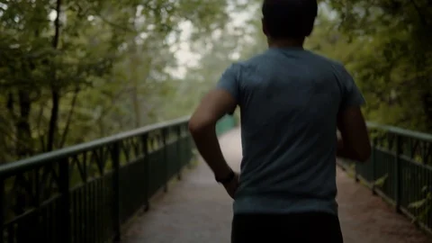 Man Running On Green Grass Field.Slow Mo... | Stock Video | Pond5