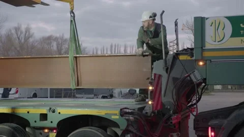 Man in safety helmet overseeing loading ... | Stock Video | Pond5