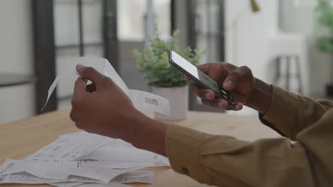 A Man Scanning a Receipt with His Cell P... | Stock Video | Pond5