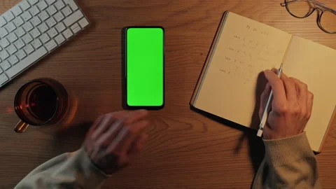 Man scrolling on green screen mobile and... | Stock Video | Pond5
