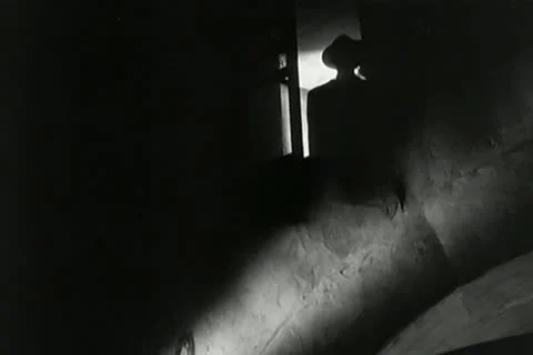 Man in shadows speaking on telephone | Stock Video | Pond5