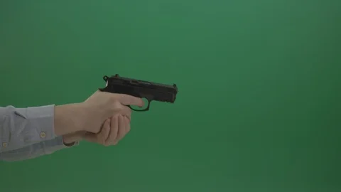 Man shooting from gun pistol isolated on... | Stock Video | Pond5