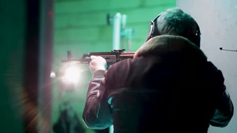 A man shoots a Kalashnikov assault rifle... | Stock Video | Pond5