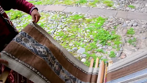A man showing his weaver work in loom an... | Stock Video | Pond5
